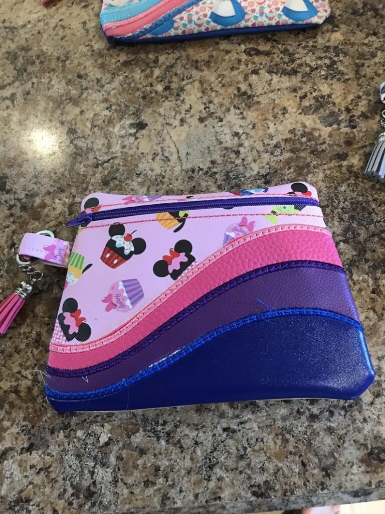 Stay Fabulous In Disney Style With These Faux Leather Wristlets - bags